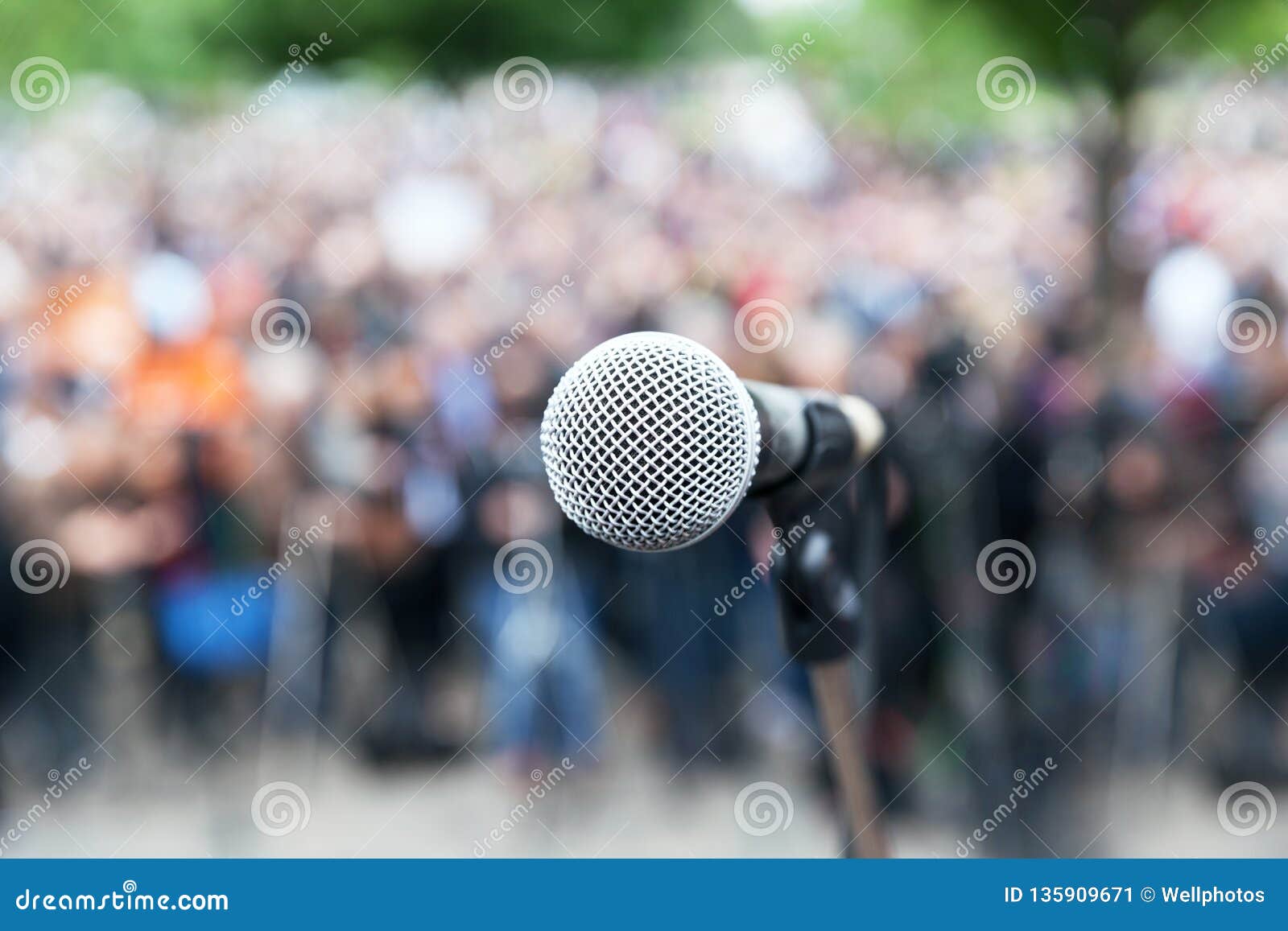 Microphone in Focus Against Blurred Protest or Public Demonstration ...