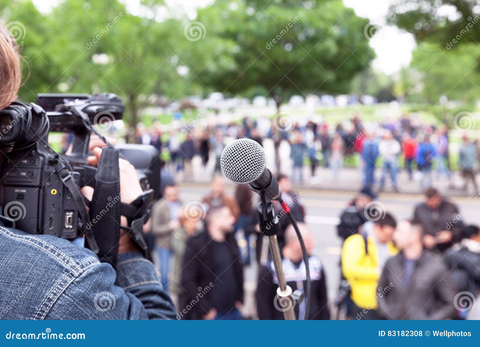 Microphone in Focus, Cameraman Filming Blurred Crowd Stock Photo ...