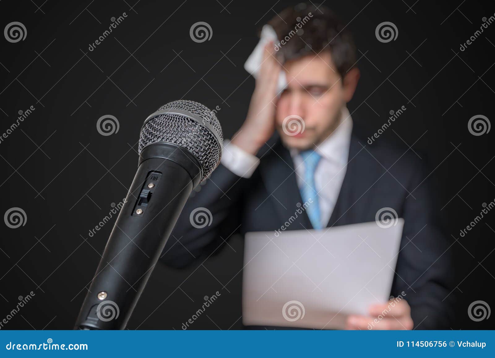 Microphone in Front of a Nervous Man Who is Afraid of Public Speech and ...