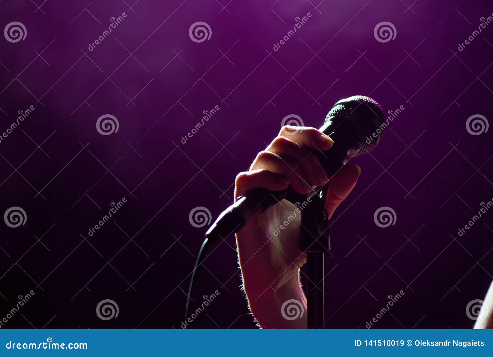 Microphone in Hand Singer on Stage. Live Music Background. Microphone ...