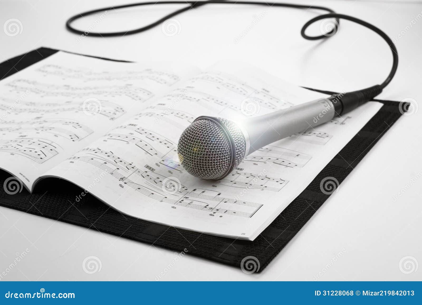 Microphone Lying on the Musical Book Stock Photo - Image of open, song ...