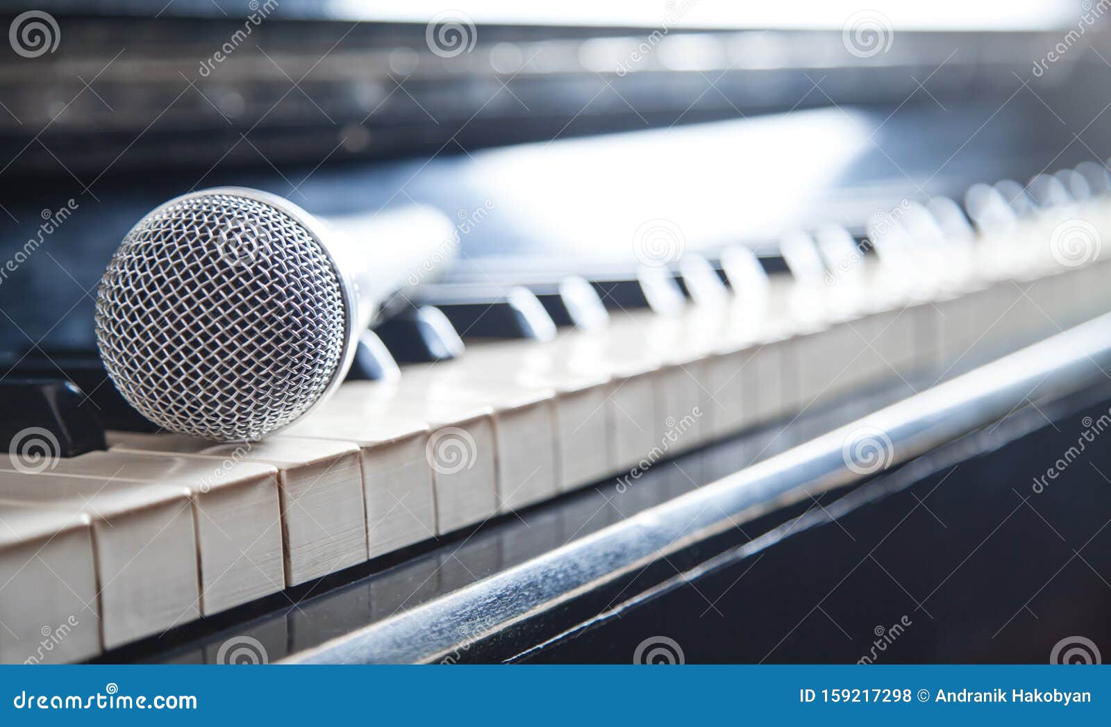 Microphone on Piano Keyboard. White and Black Stock Photo - Image of ...