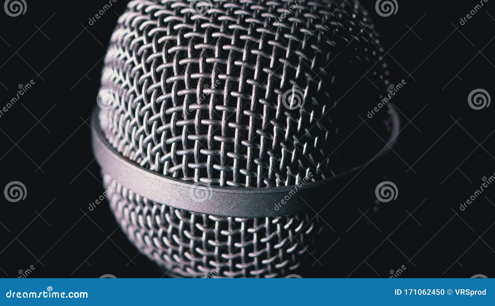 The Microphone Rotates on a Black Background. Dynamic Microphone Grid ...