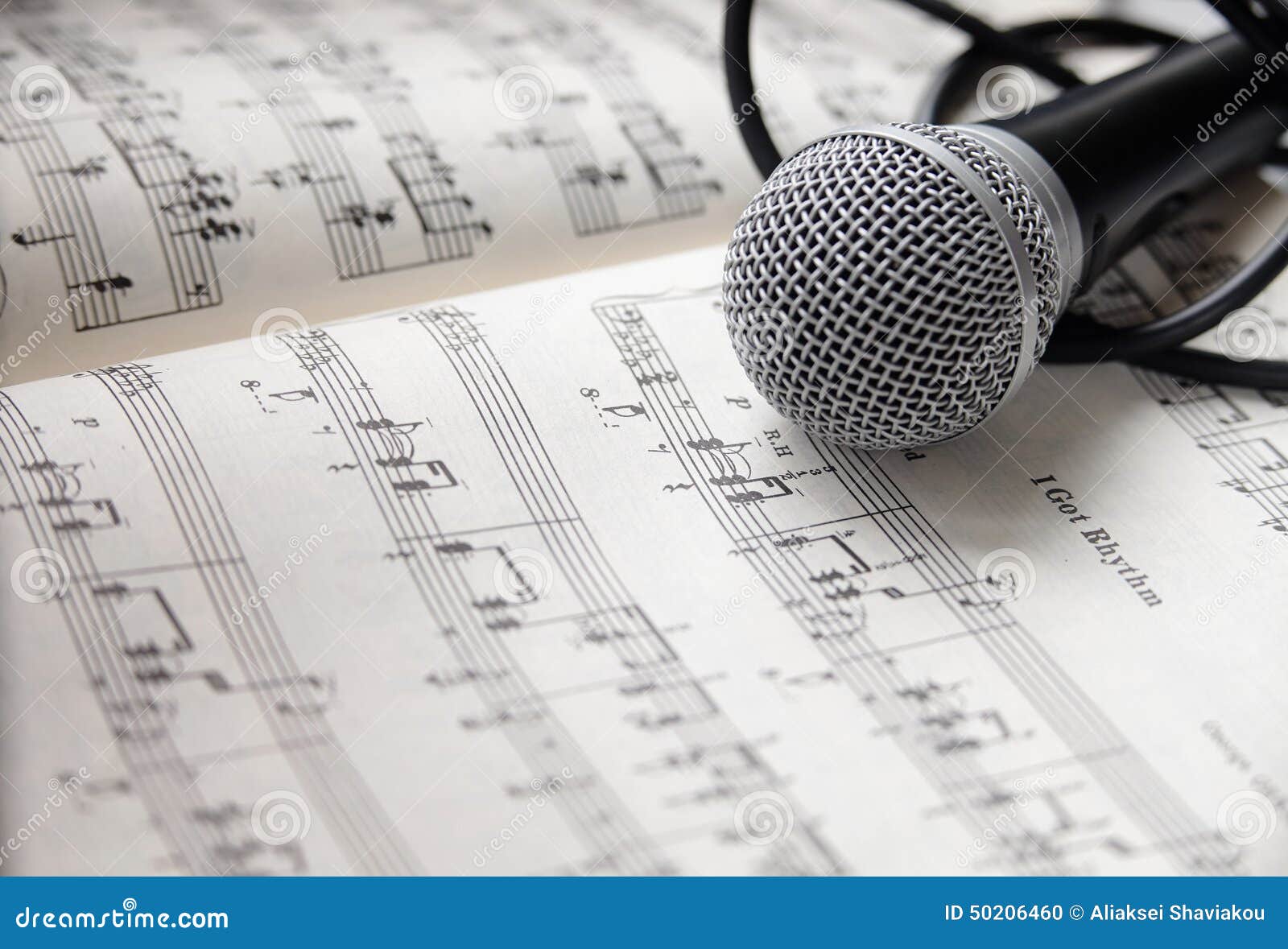 Microphone on Sheet of Music Stock Photo - Image of notes, music: 50206460