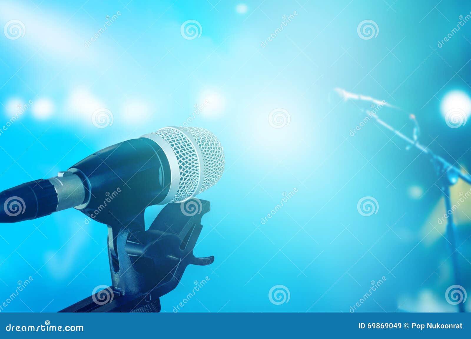 Microphone on Stage with Blue Vibrant Lighting Concert Stock Image ...