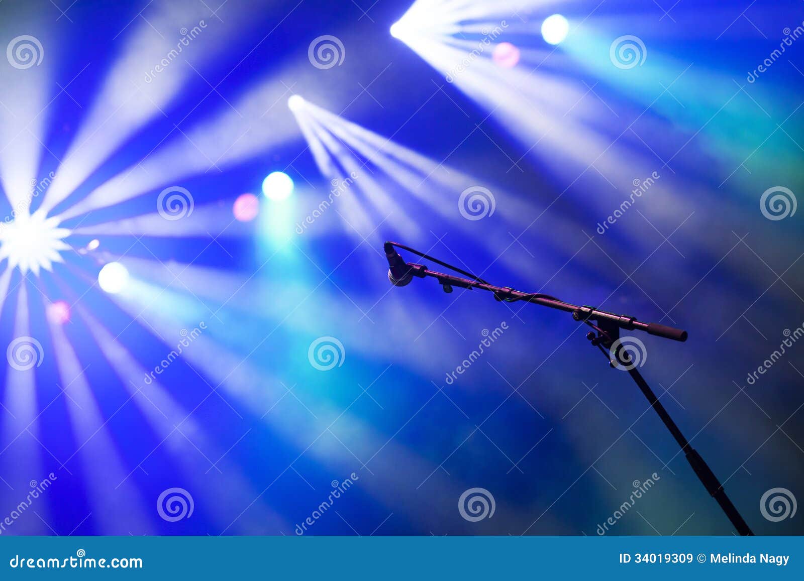 Microphone in stage lights stock image. Image of entertainment - 34019309