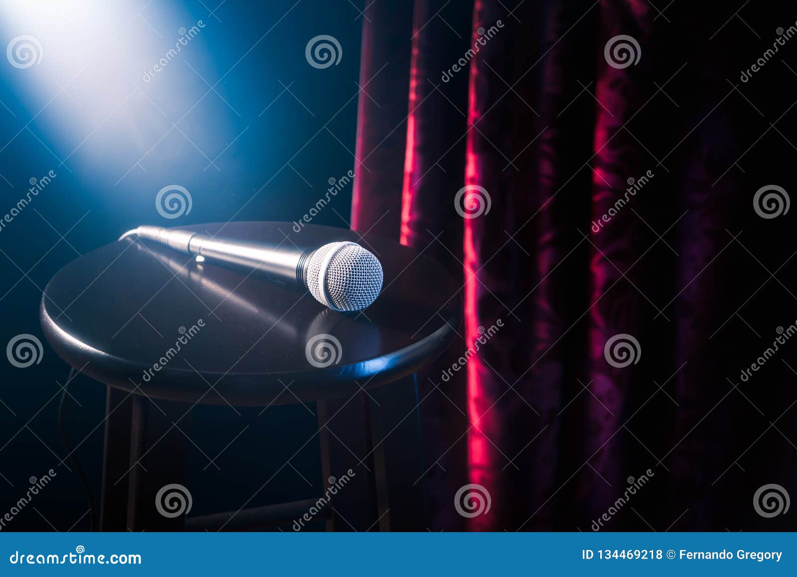 Microphone on a Wooden Stool on a Stand Up Comedy Stage with Reflectors ...