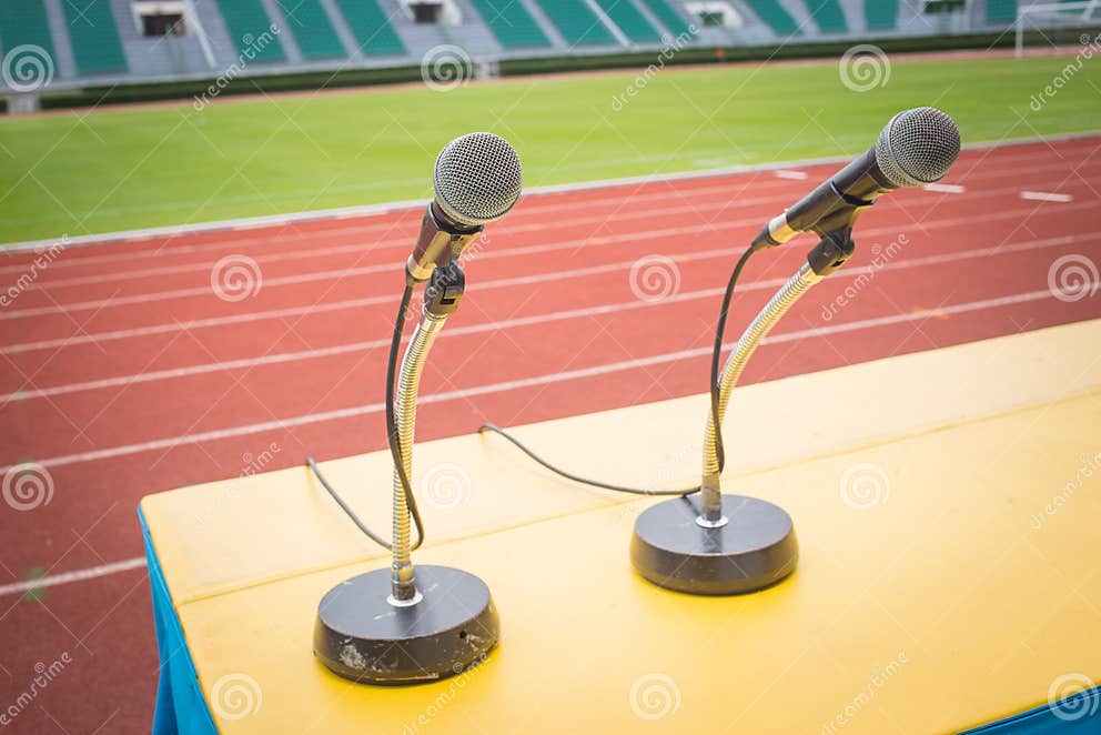 Microphone on Table Side Sport Field in Stadium. Stock Image - Image of ...