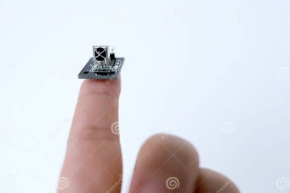 Microprocessor on Finger of Female Hand on White Background, Research ...