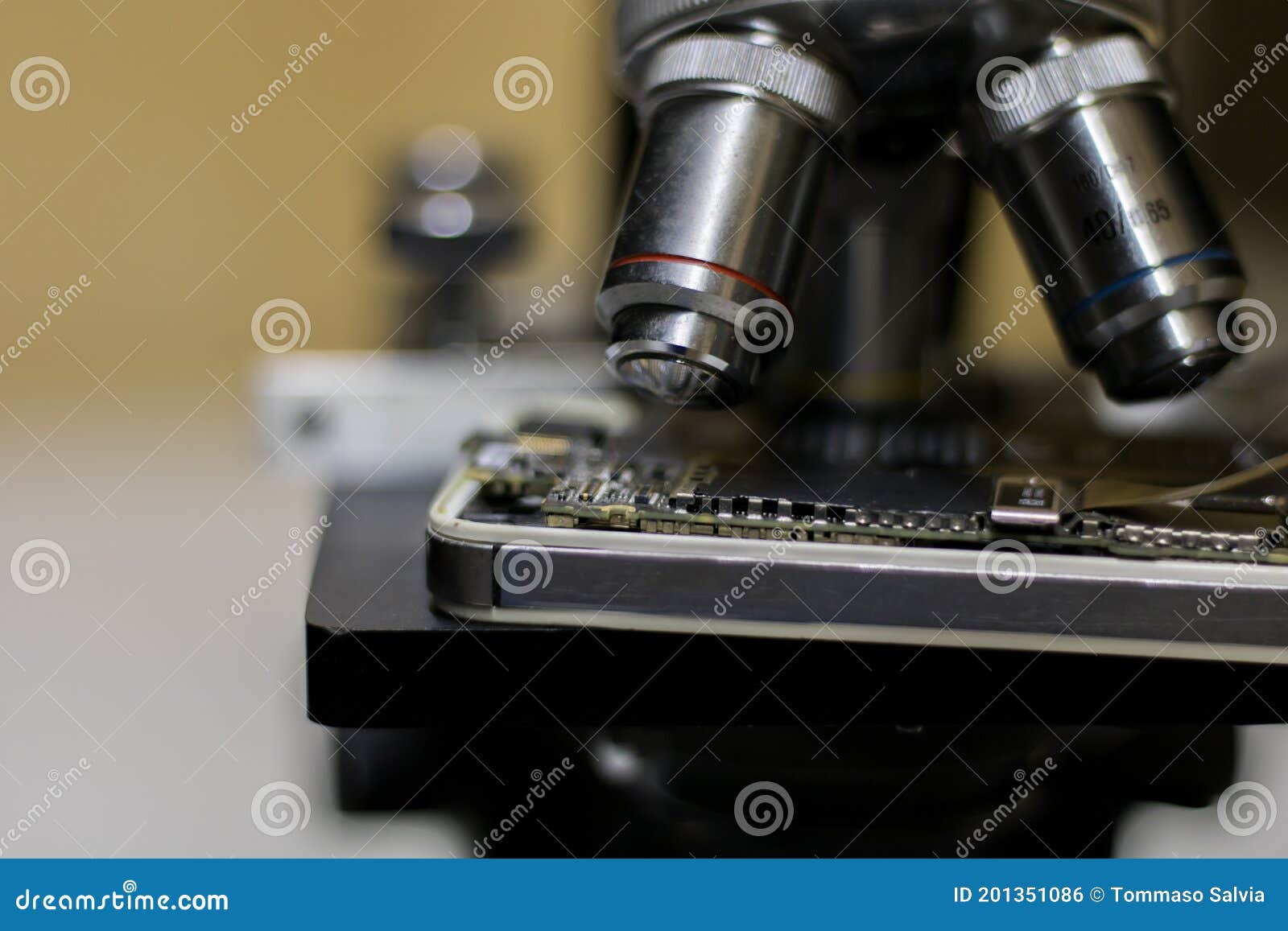 A Microscope that is Analyzing a Mobile Phone. Stock Photo - Image of ...