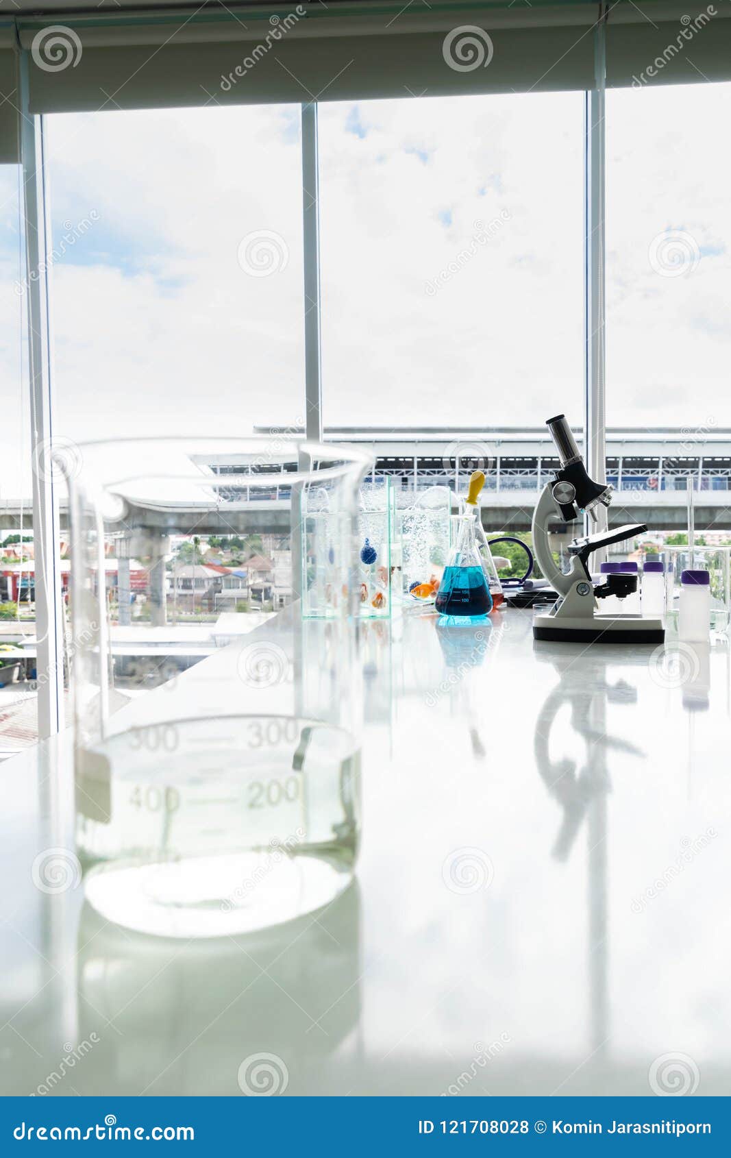Microscope and beaker. stock photo. Image of beakers - 121708028