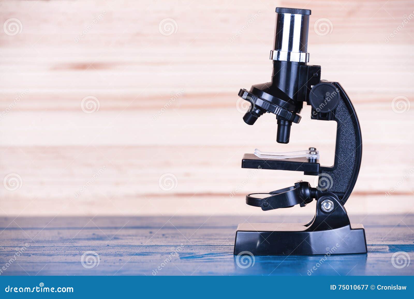 Microscope on a Blue Natural Wooden Background. Stock Image - Image of ...