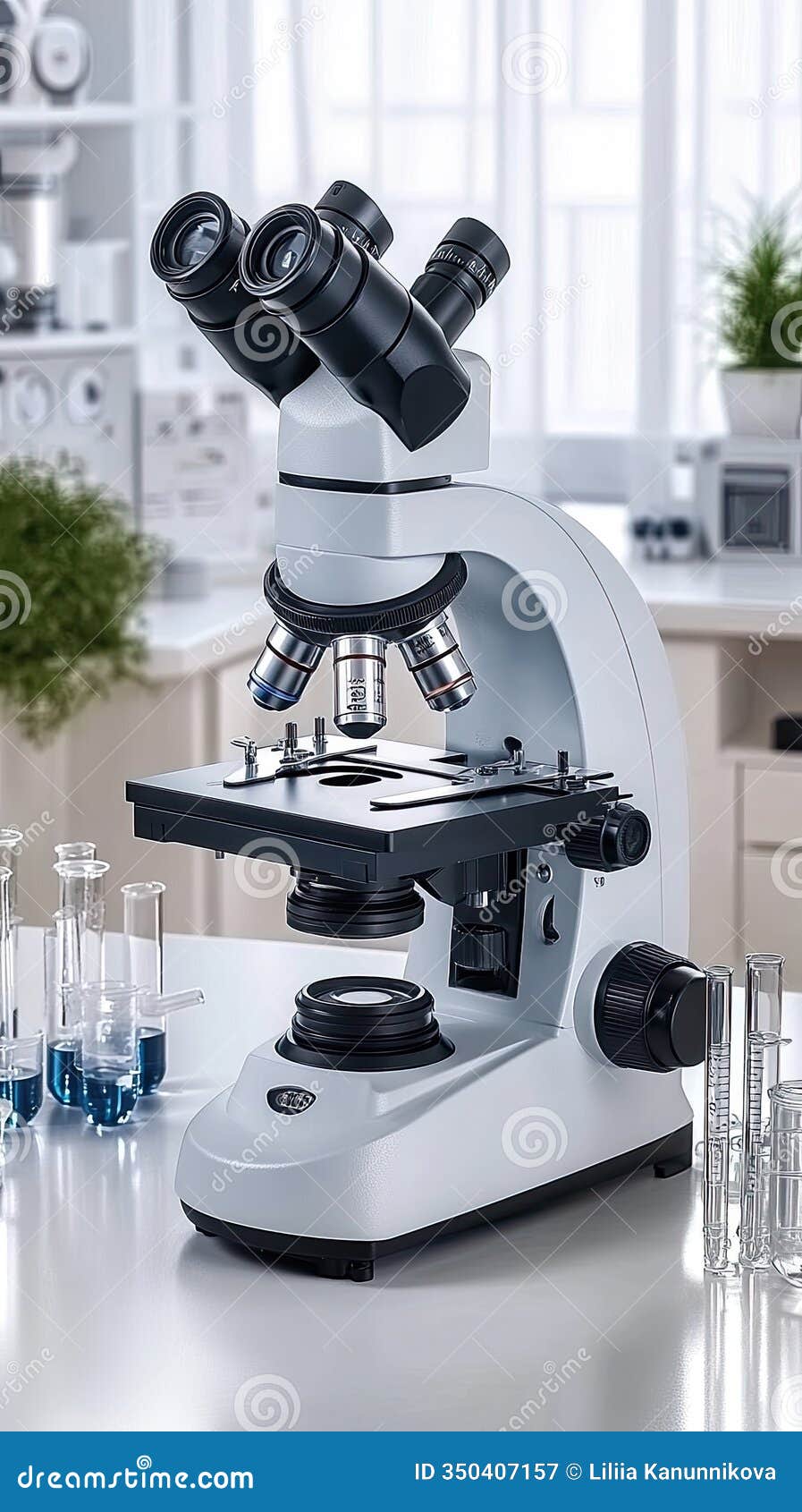 A Microscope and Clear Test Tubes with Liquid are Displayed on a ...