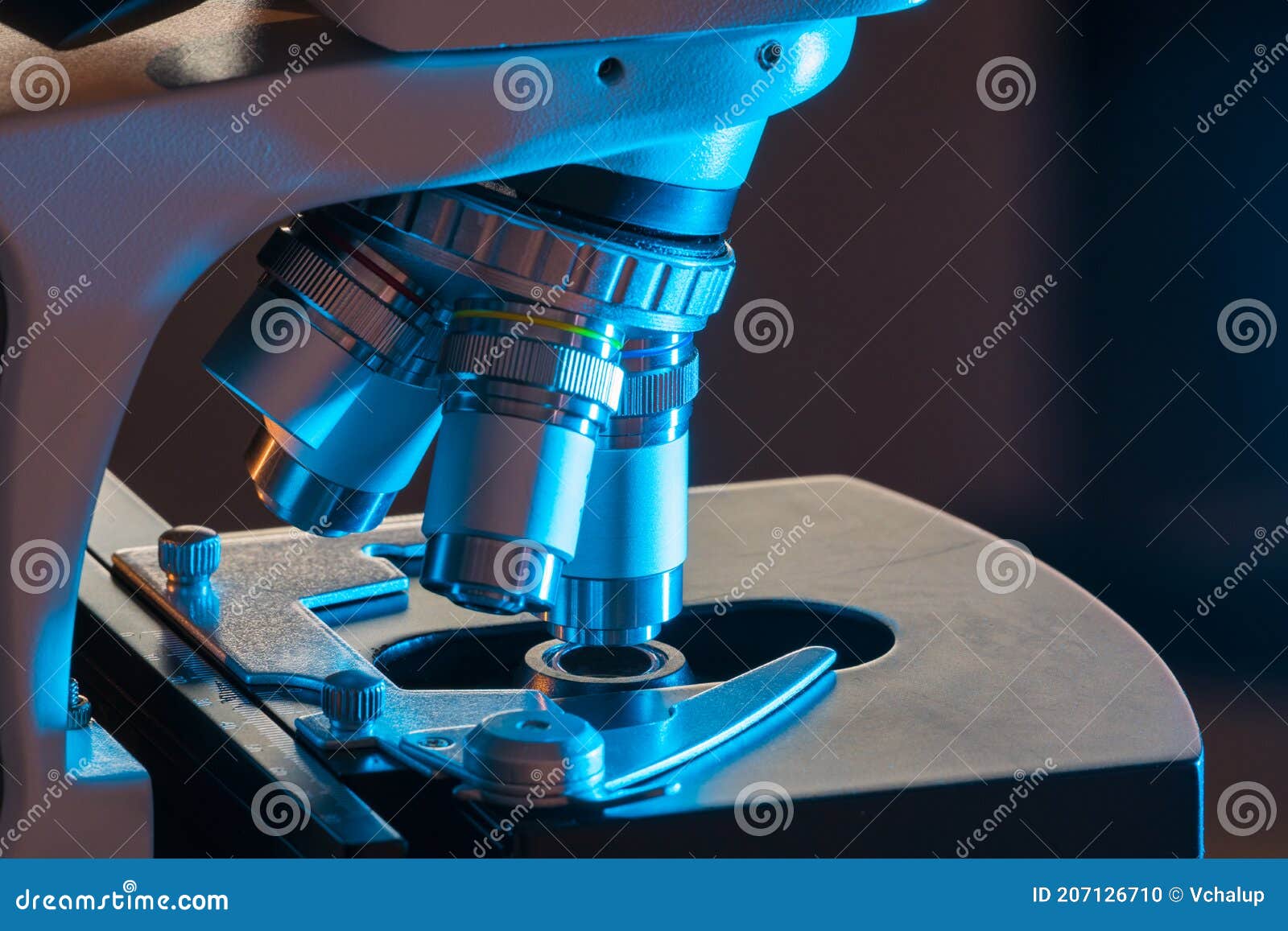 Microscope in Laboratory at Night in Blue Light. Microbiology and ...