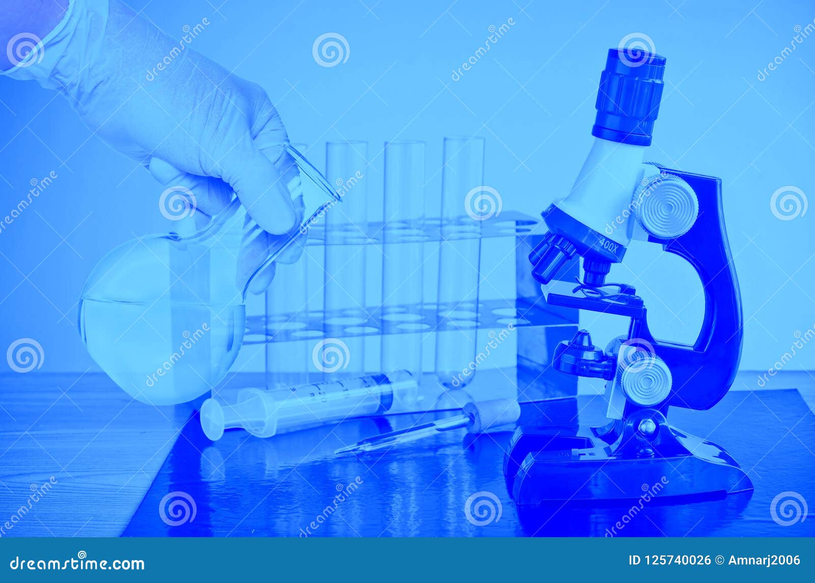 Microscope and Laboratory Test Tube on Light Blue Background , S Stock ...
