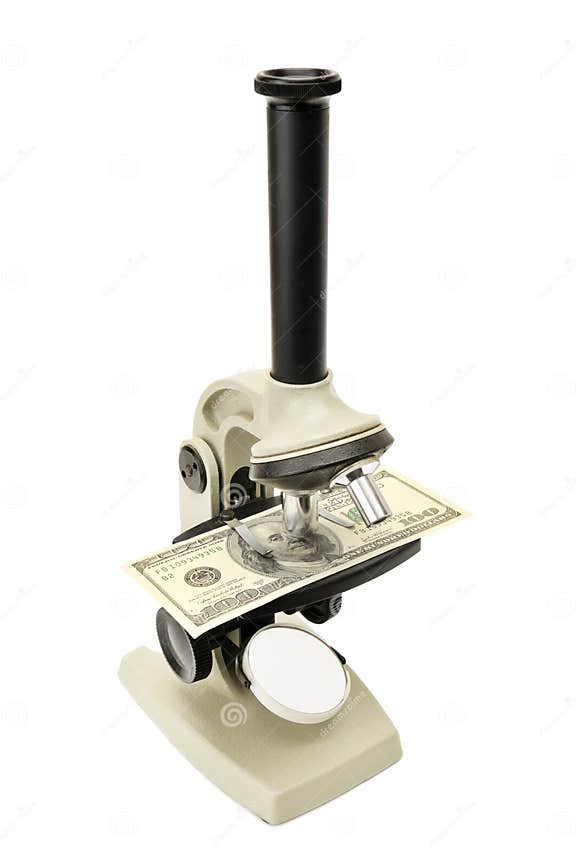 Microscope and money stock photo. Image of laboratory - 14322264