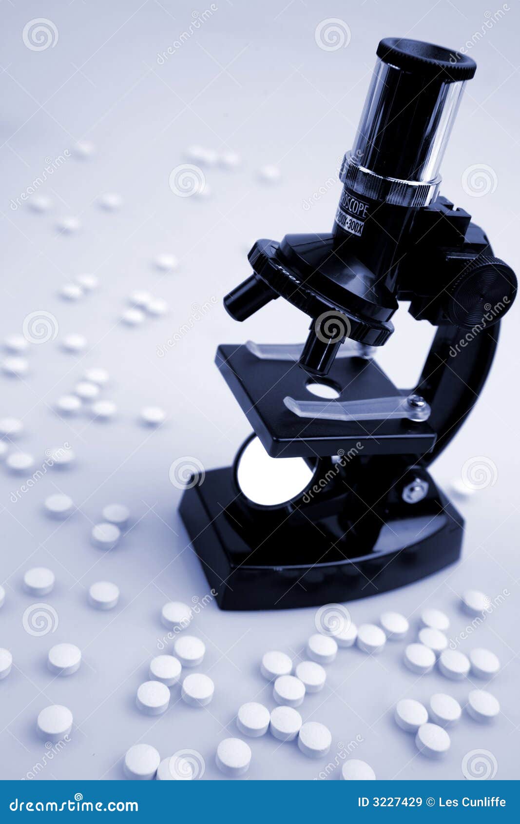 Microscope & pills stock image. Image of magnify, discover - 3227429