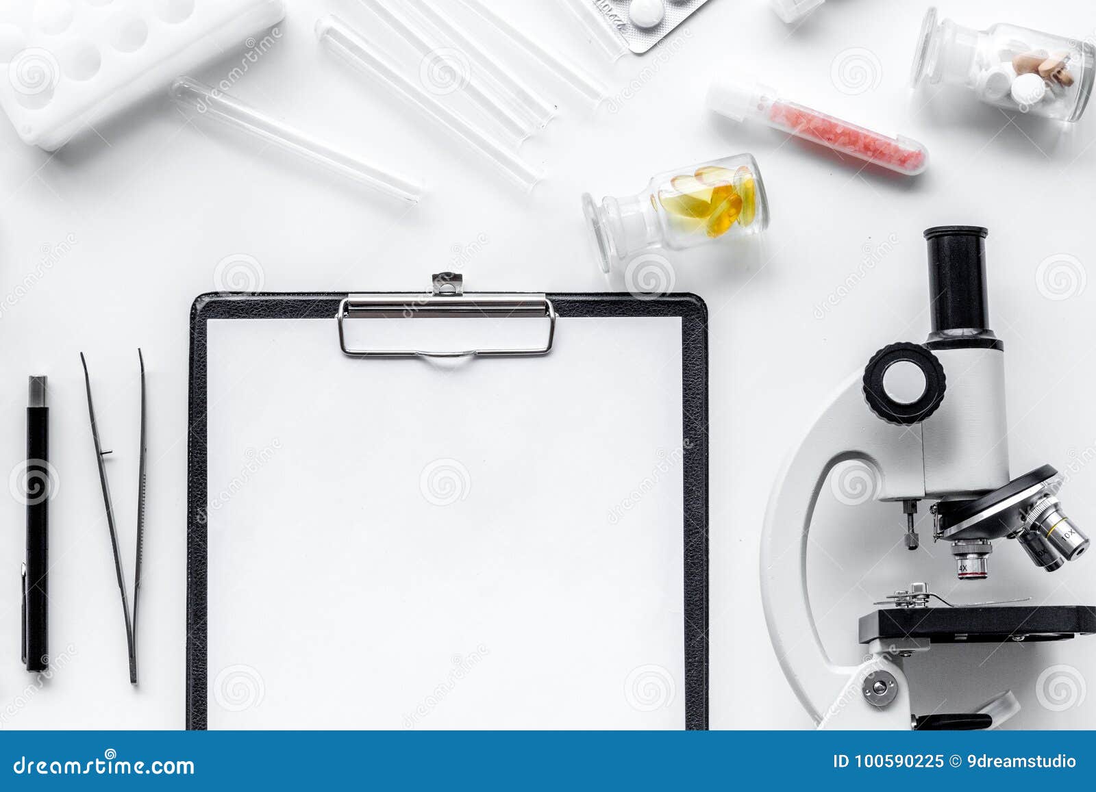 Microscope, Pills and Tablet on White Background Top View Mockup Stock ...