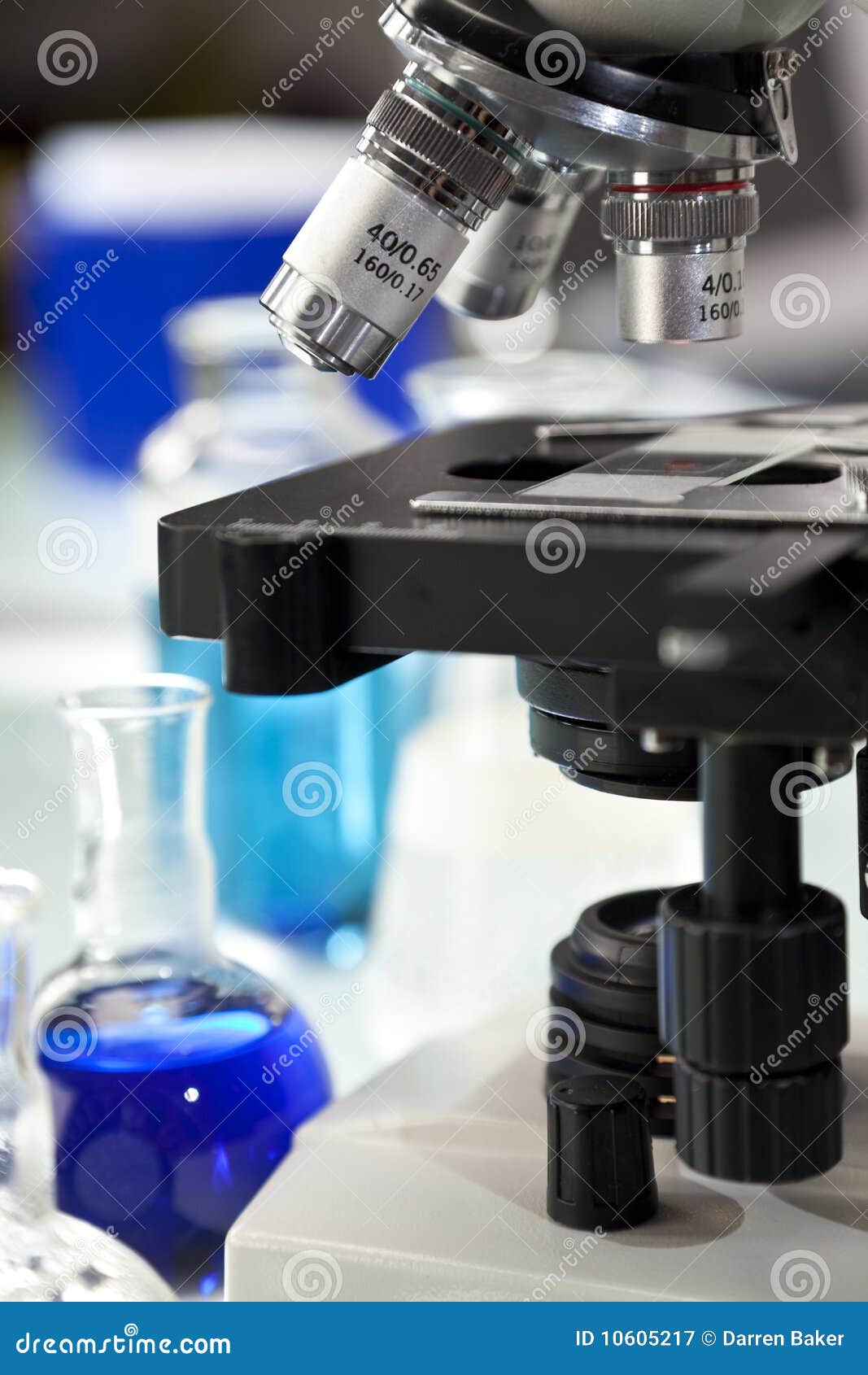 Microscope in a Science Laboratory with Flasks Stock Image - Image of ...