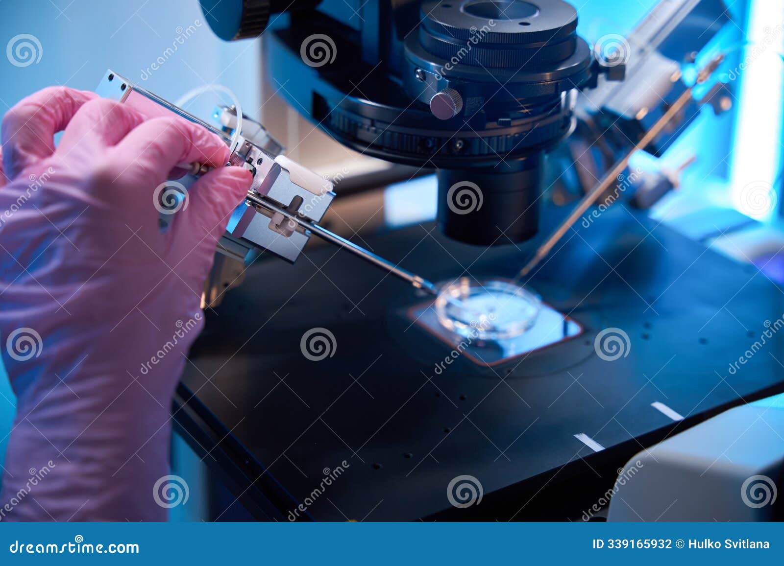 Microscope Setup with Micromanipulator Performing Detailed Lab Work ...