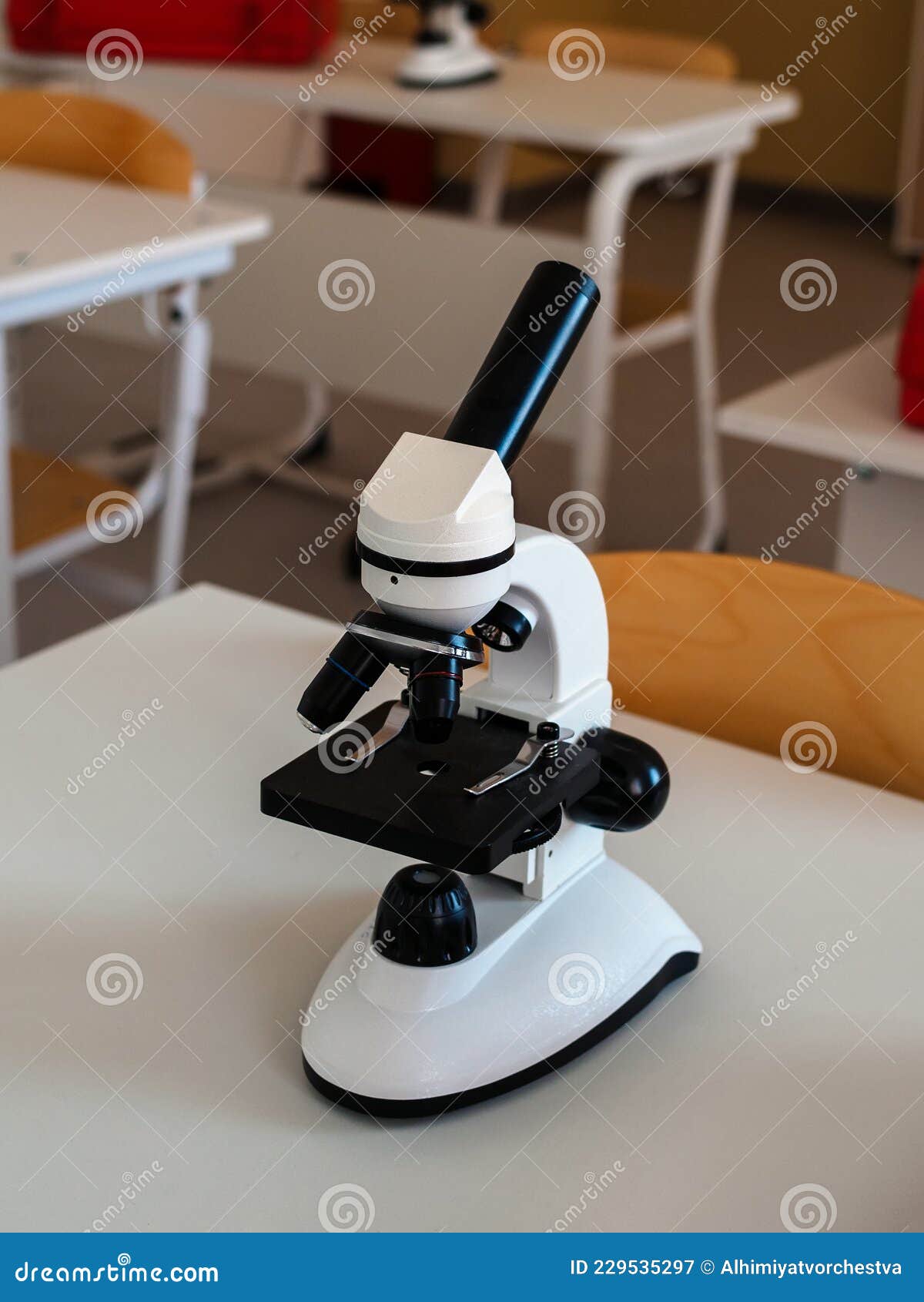 A Microscope for a Student at a Desk in a Classroom Stock Image - Image ...