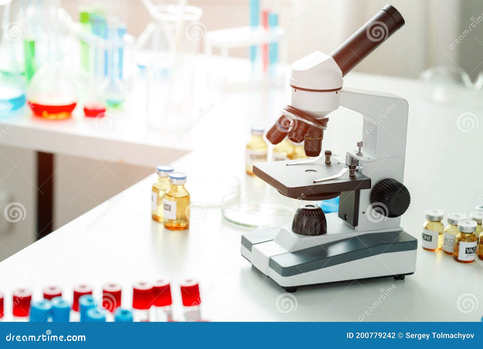 Microscope on the Table with Glassware in Laboratory Stock Photo ...