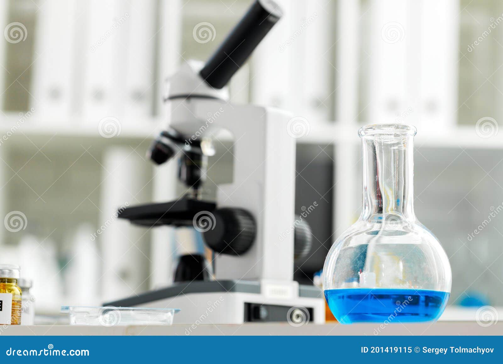 Microscope on the Table with Glassware in Laboratory Stock Image ...
