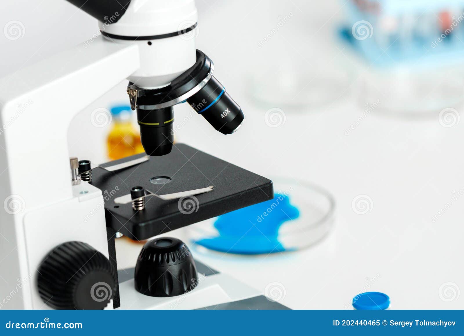 Microscope on the Table with Glassware in Laboratory Stock Image ...