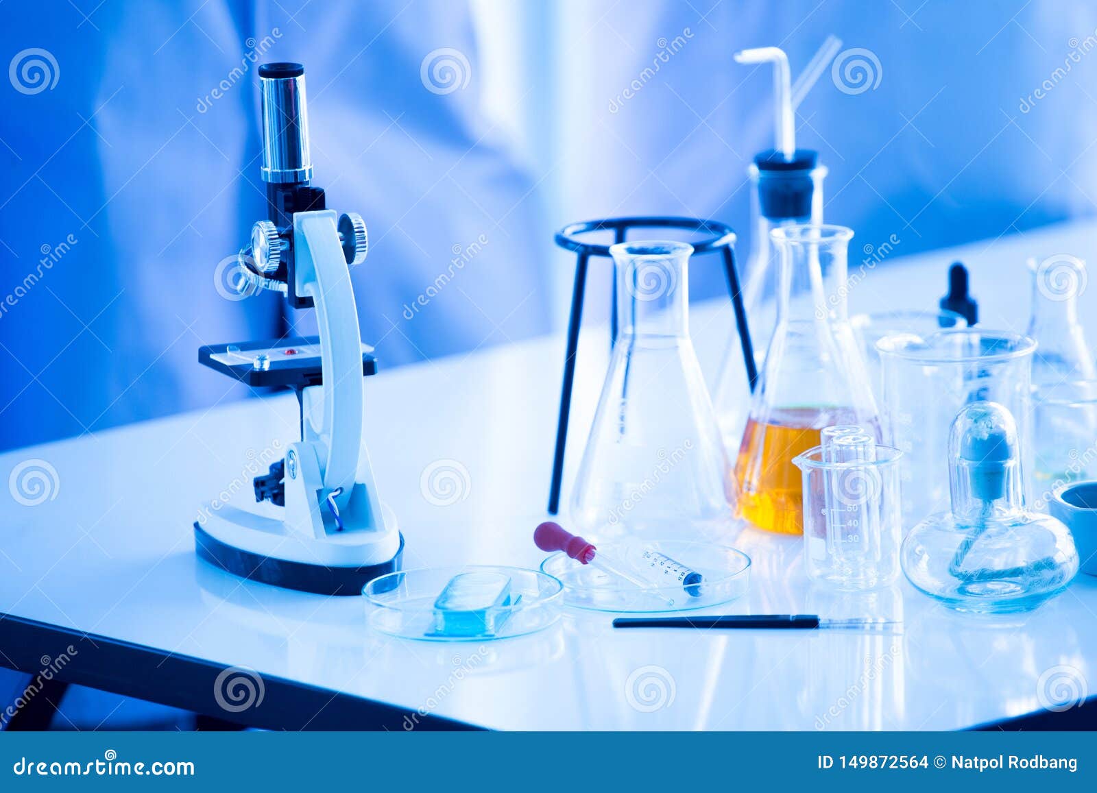 Microscope Test Tubes and Beaker on Blue Background Stock Photo - Image ...
