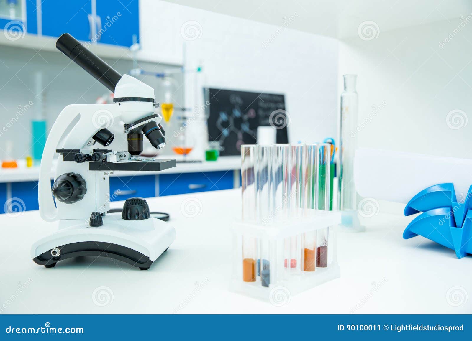 Microscope and Test Tubes in Laboratory Stock Image - Image of ...