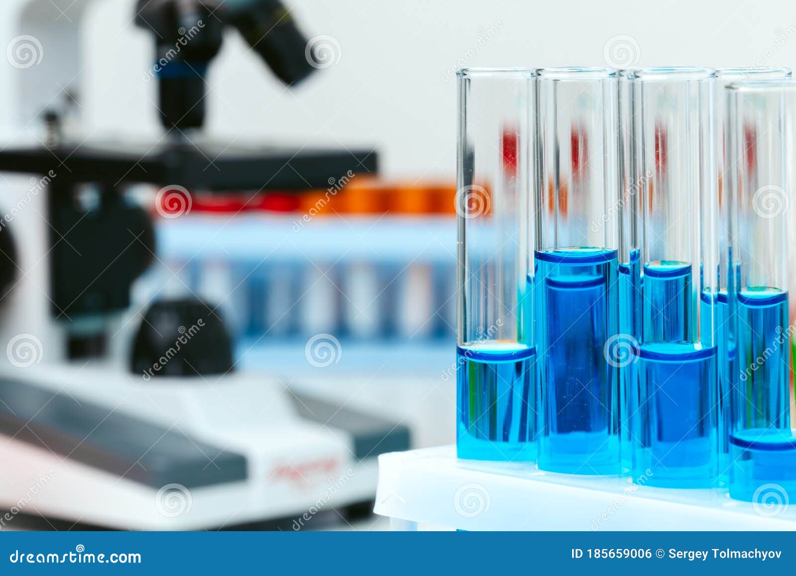 Microscope and Test Tubes on Table in Laboratory, Close Up Stock Photo ...