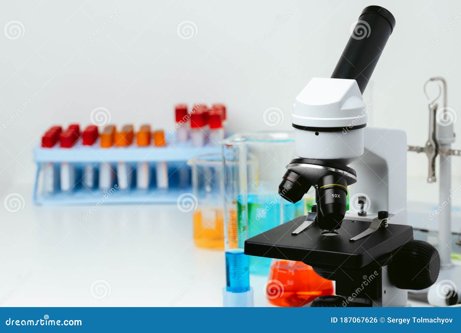 Microscope and Test Tubes on Table in Laboratory, Close Up Stock Photo ...