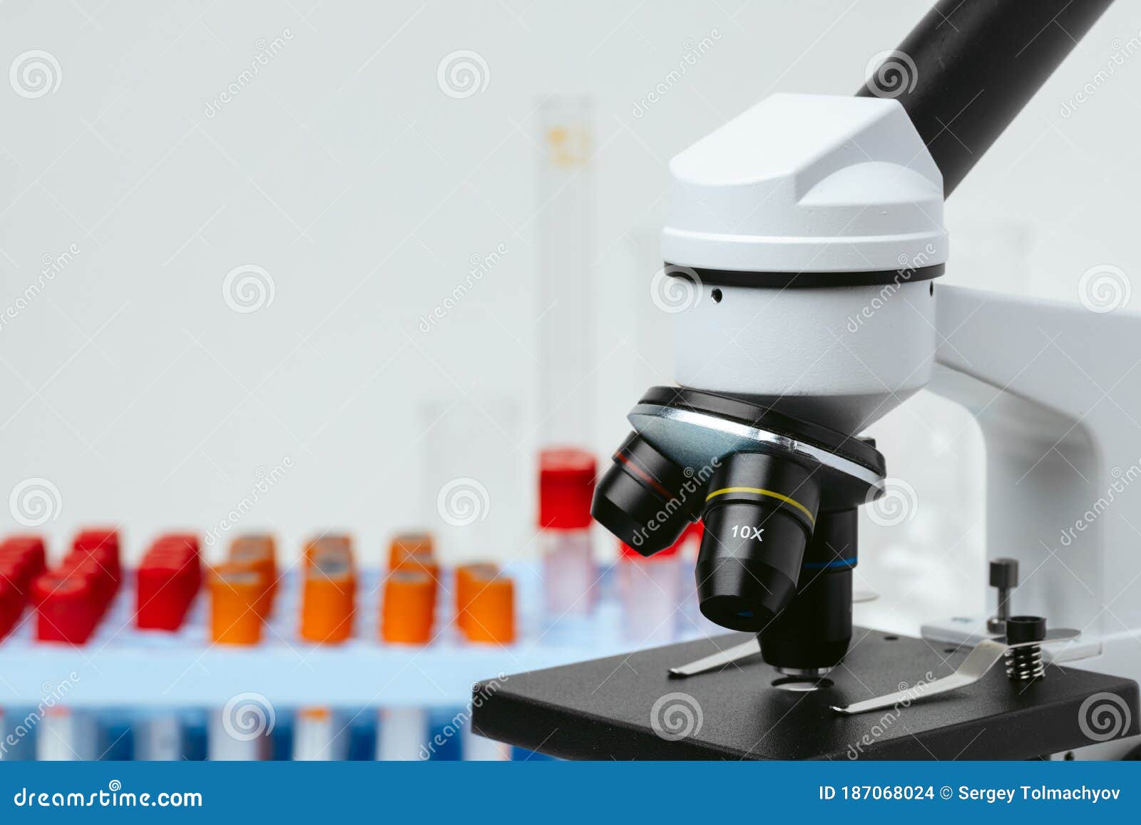 Microscope and Test Tubes on Table in Laboratory, Close Up Stock Photo ...