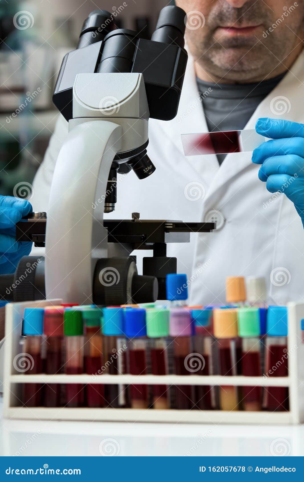 Microscopist Scientist Examining Biological Samples With A Microscope ...