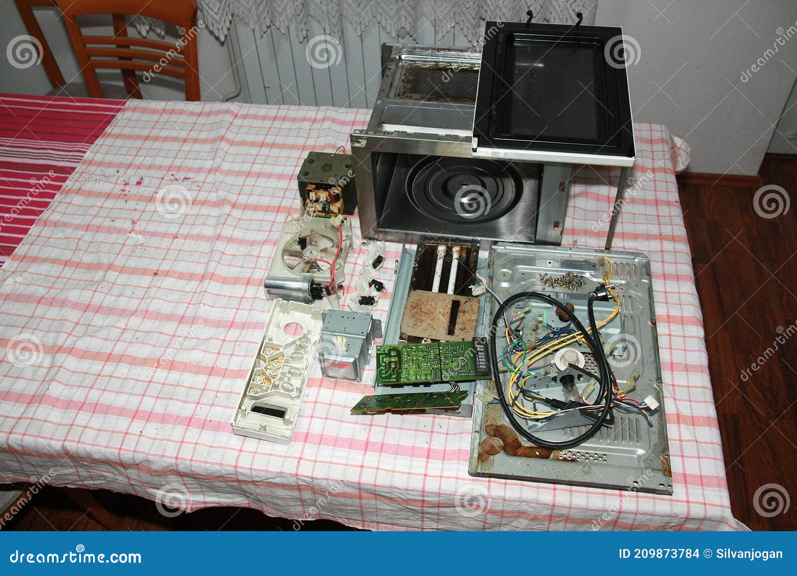Microwave Oven Disassembled on a Kitchen Table Stock Photo - Image of ...