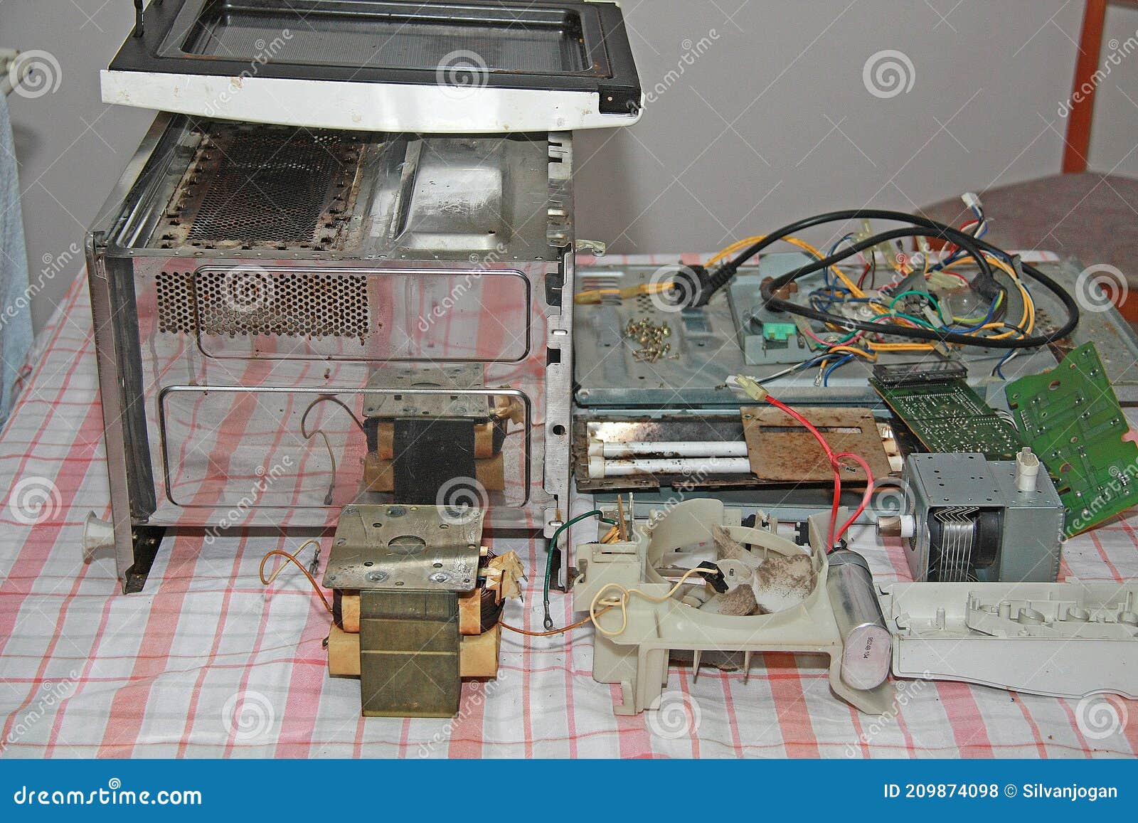 Microwave Oven Disassembled on a Kitchen Table Stock Photo - Image of ...