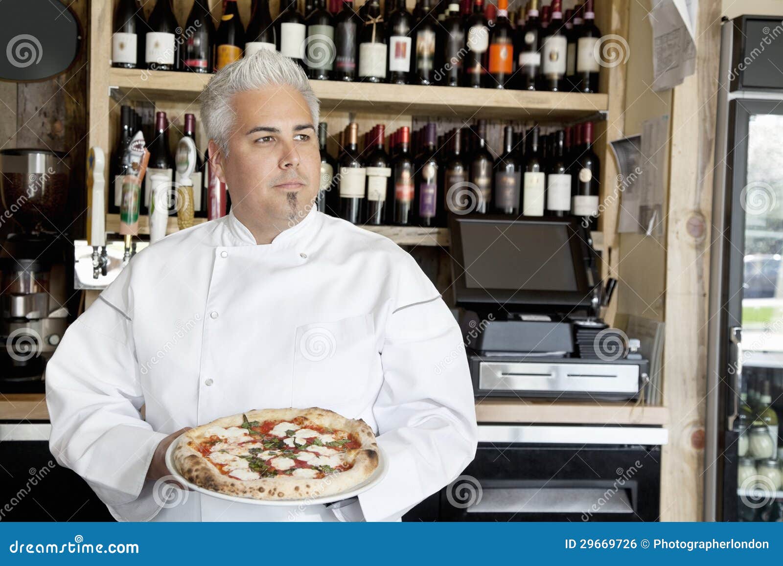 Mid Adult Chef Holding Pizza while Looking Away Stock Photo - Image of ...
