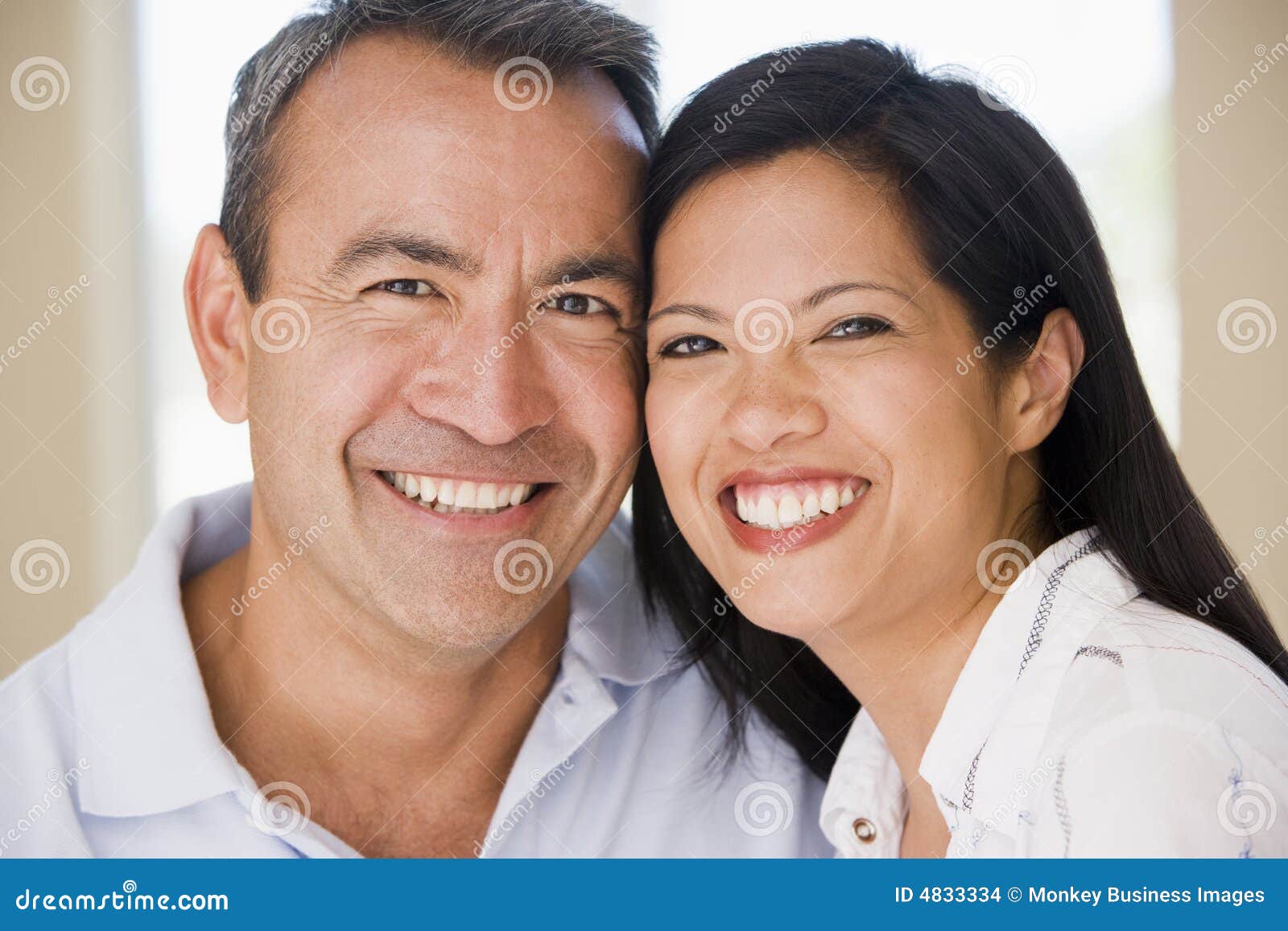 Mid-adult Couple Smiling at Camera Stock Photo - Image of inside ...