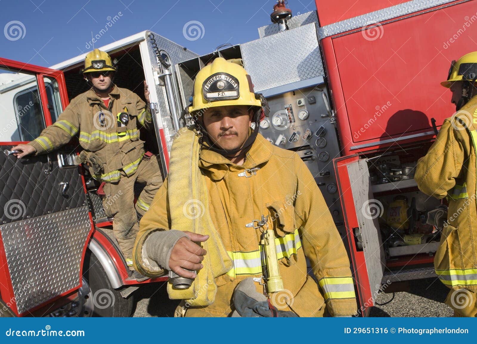 Mid Adult Fire Worker with Coworkers Stock Photo - Image of adult, hero ...