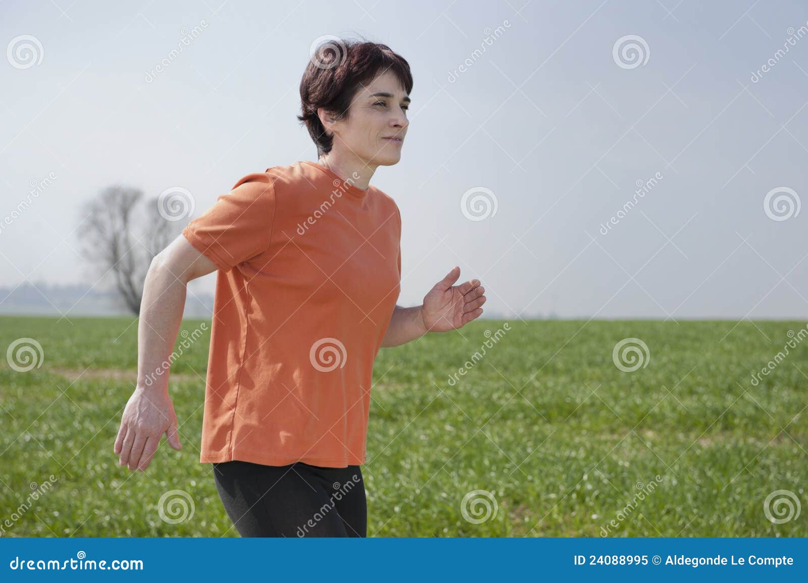 Mid adult jogging woman stock image. Image of woman, scene - 24088995