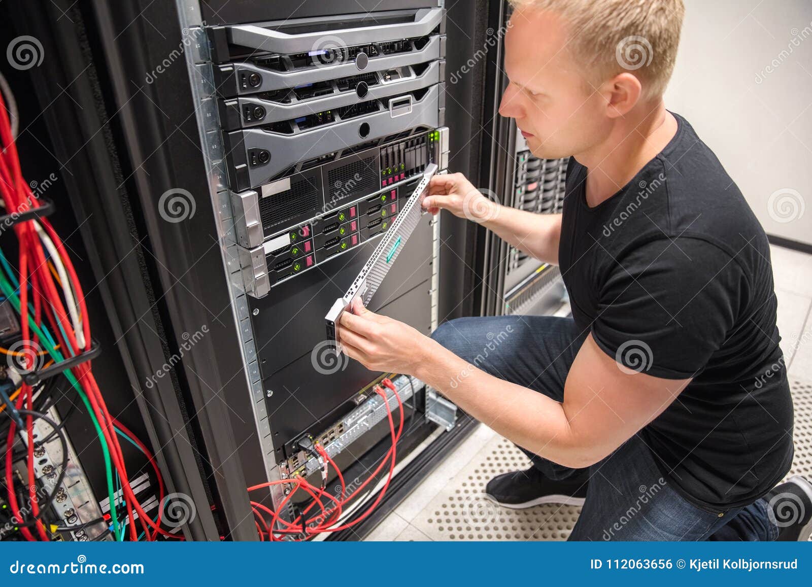 Engineer Checking Computer Server in Datacenter Stock Photo - Image of ...