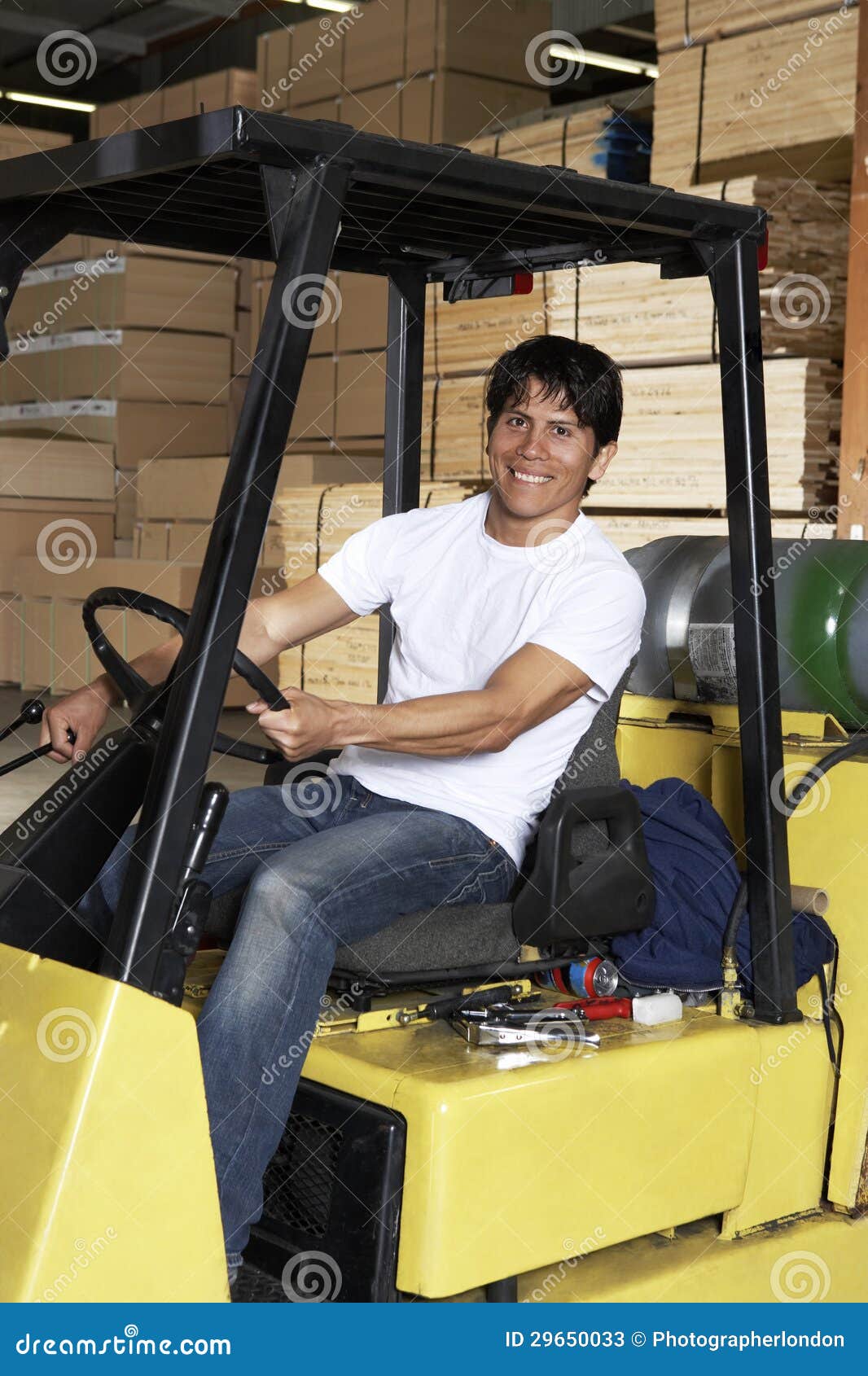 Mid Adult Man Driving Forklift Loader in Warehouse Stock Image - Image ...