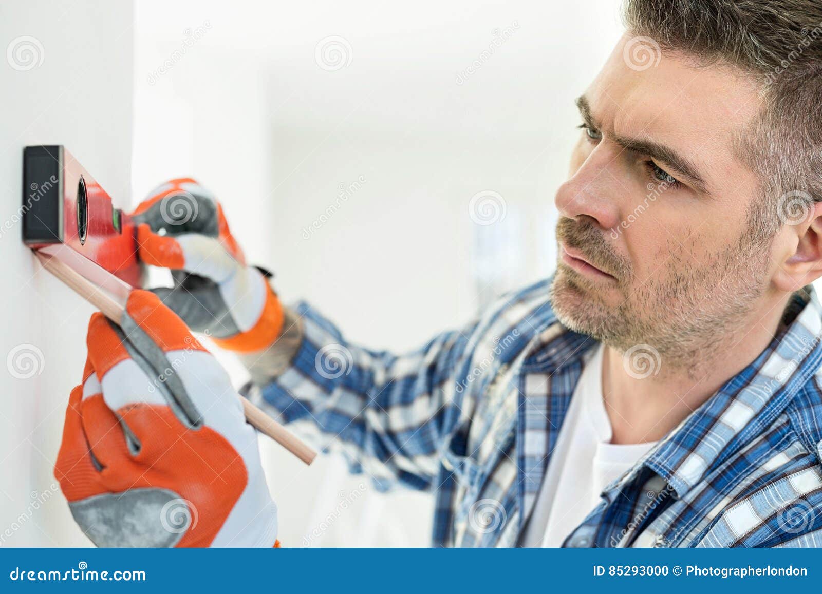 Mid-adult Man Marking on Wall with Level Stock Photo - Image of pencil ...