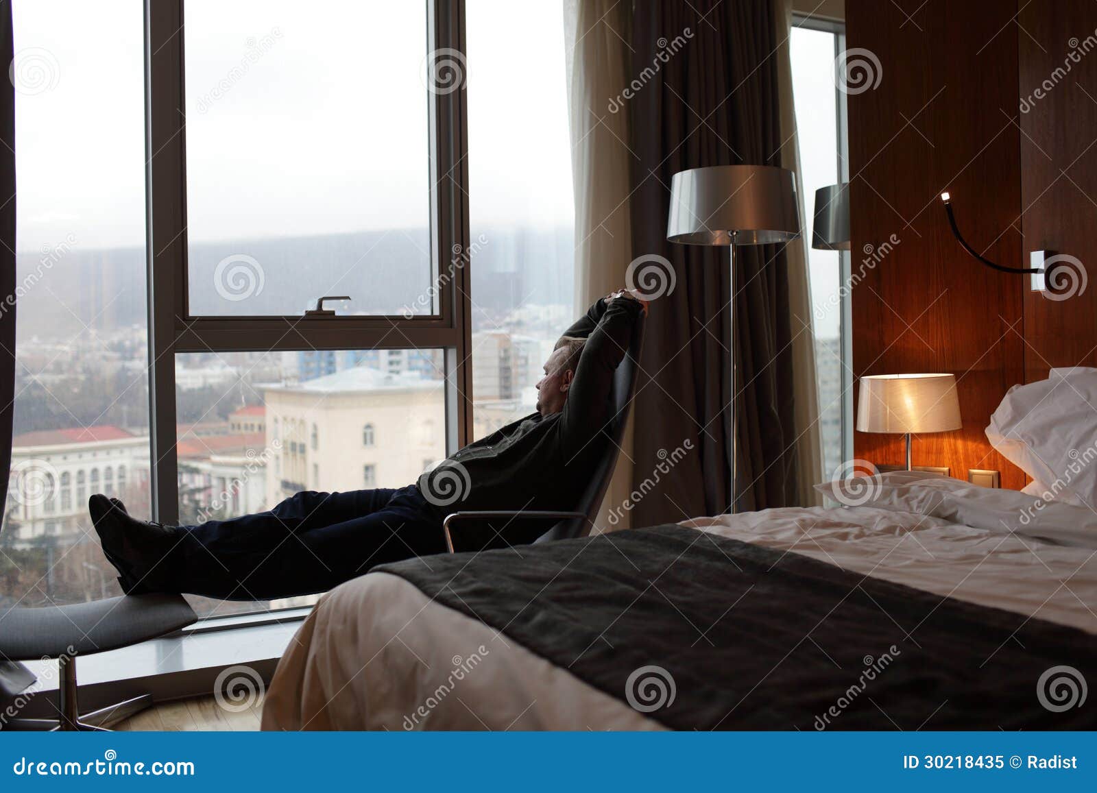 Man resting in hotel room stock image. Image of caucasian - 30218435