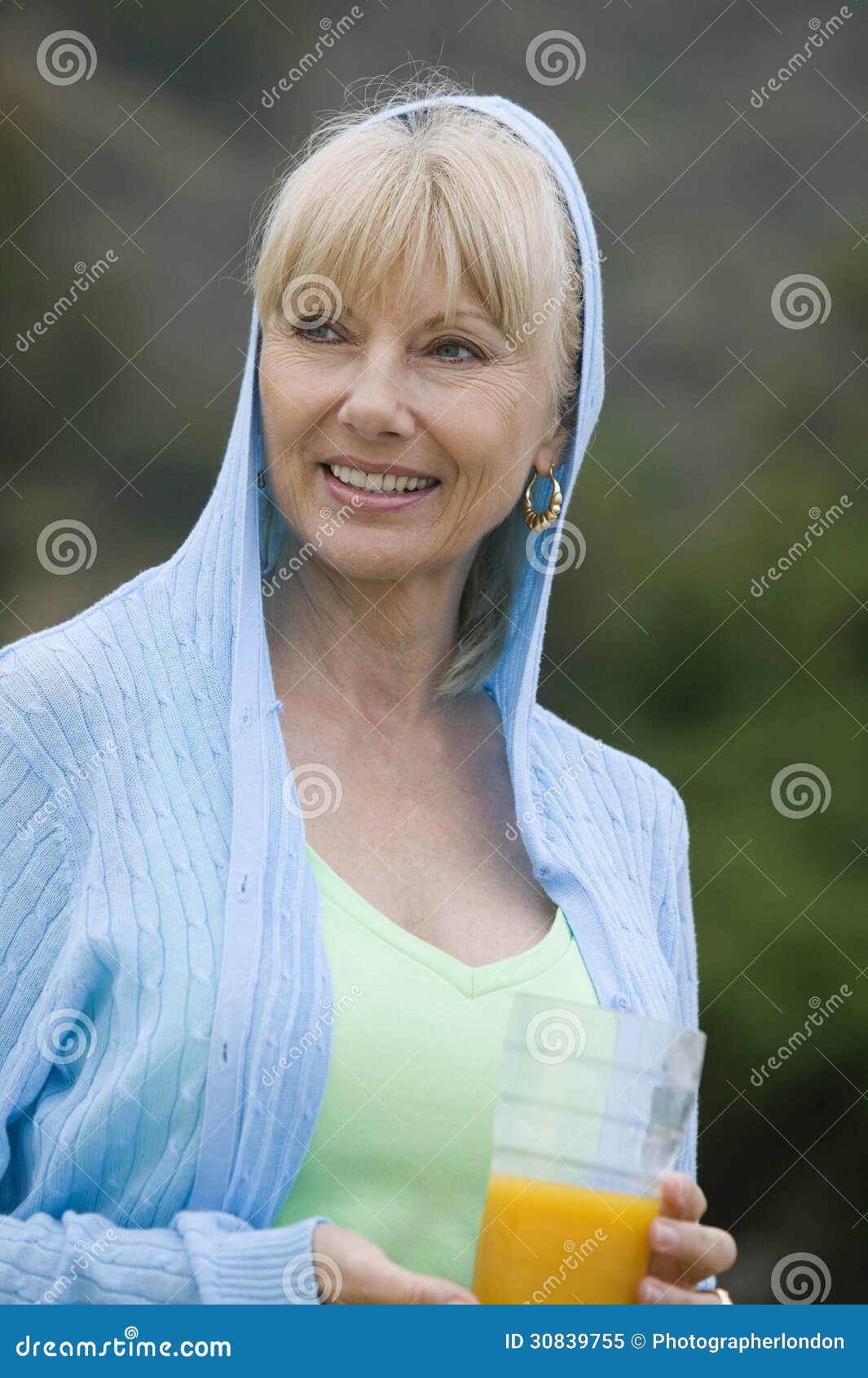 Mid Adult Woman Holding A Glass Of Orange Juice Stock Image Image Of