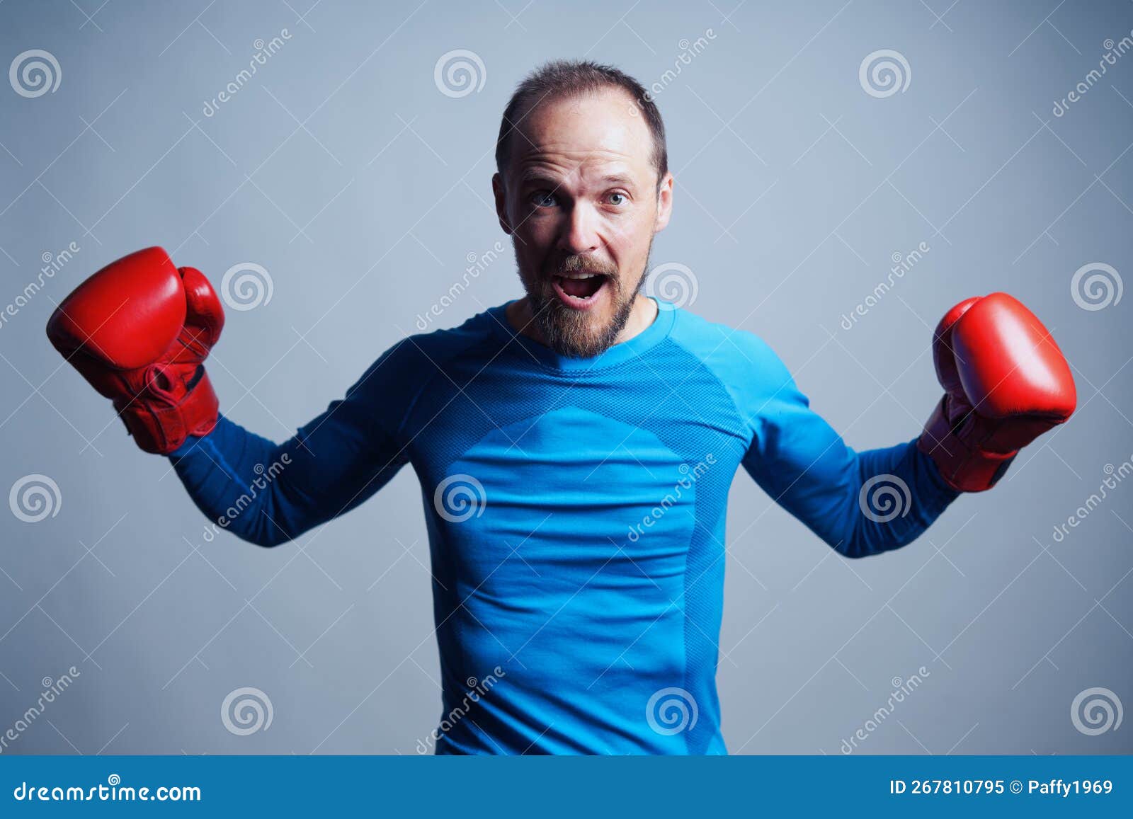Mid Age Slim Man Wearing Box Gloves with Spreaded Hands Looking at ...