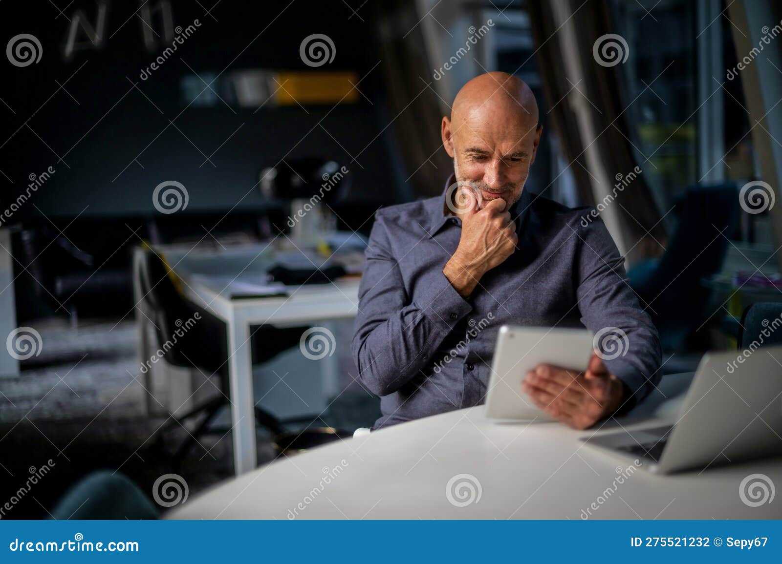 Mid Aged Professional Man Sitting at the Office and Using Touchpad and ...