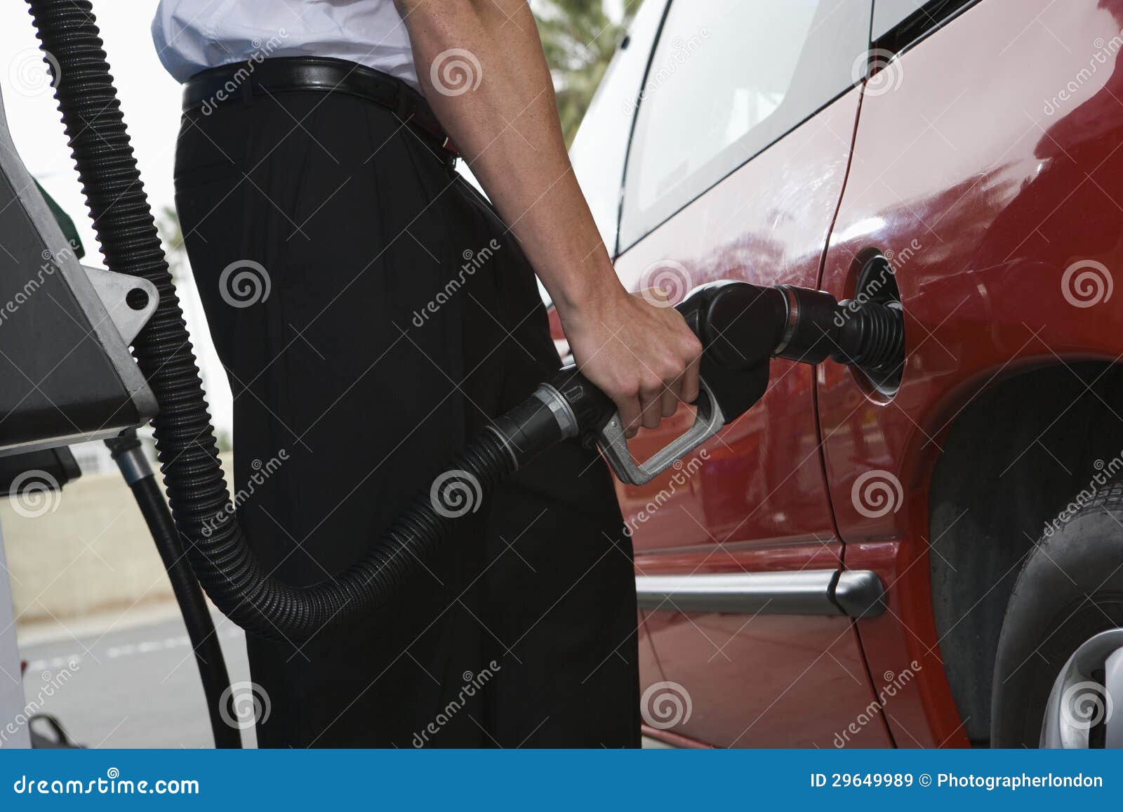 Mid Section of a Businessman Refueling His Car Stock Image - Image of ...
