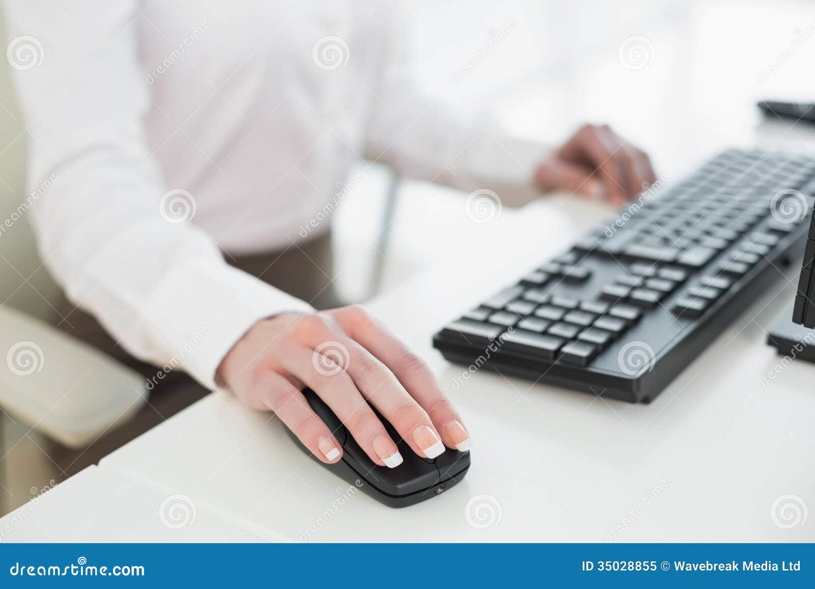 Mid Section of Businesswoman Using Mouse in Office Stock Image - Image ...