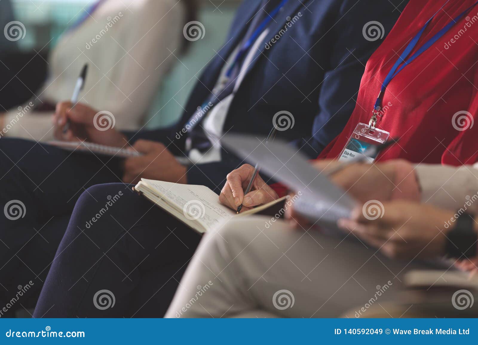 Business People Writing on Notepad in a Business Seminar Stock Image ...